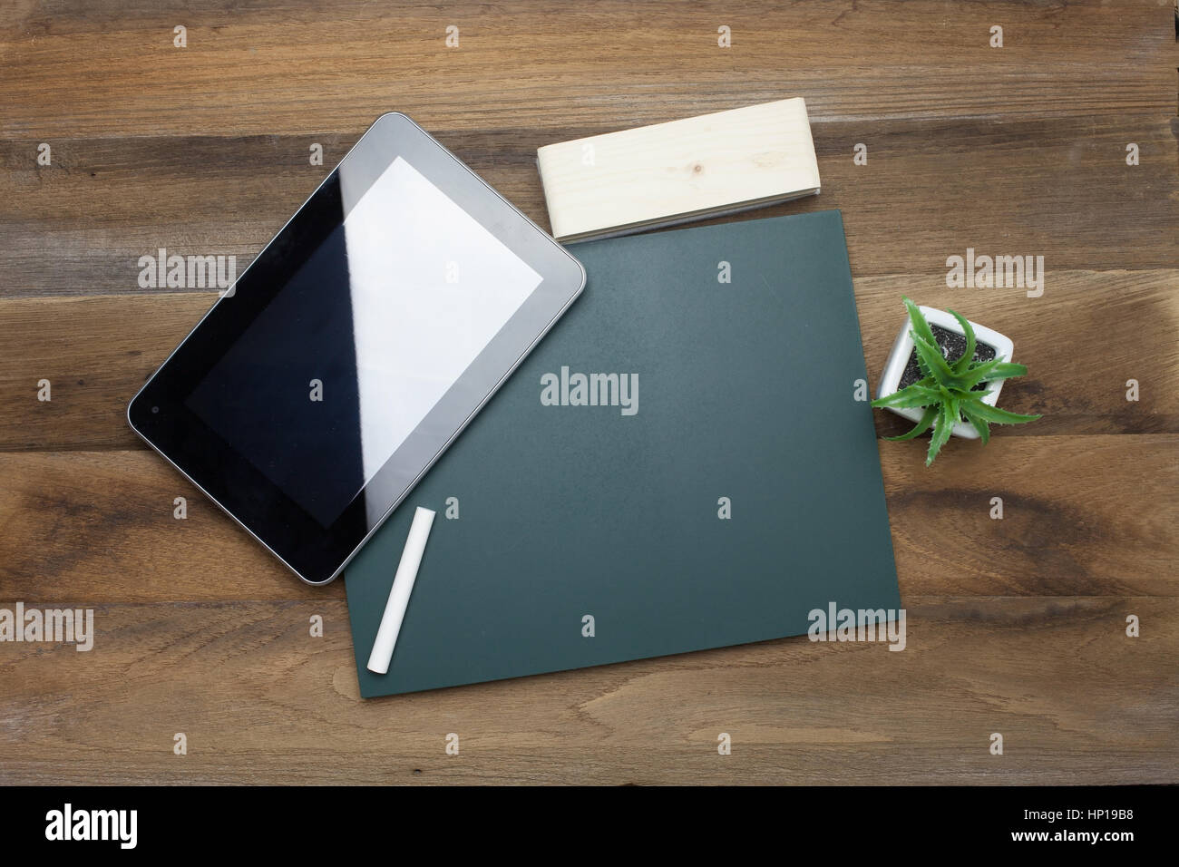 Tablet,Colorful Chalks,Chalk board and eraser on wooden background ...