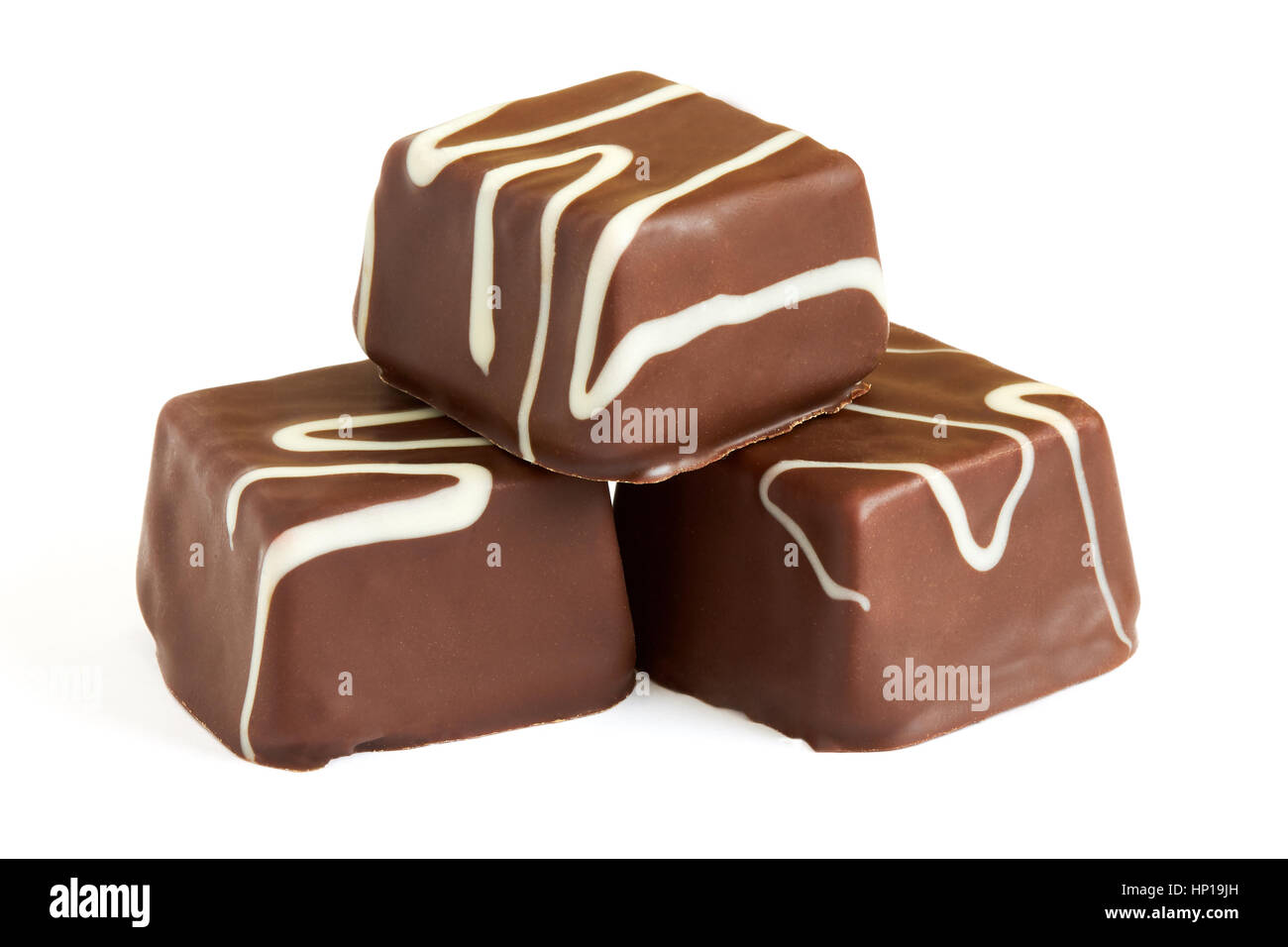 Small chocolate cakes (mignon) with cream isolated on white background ...