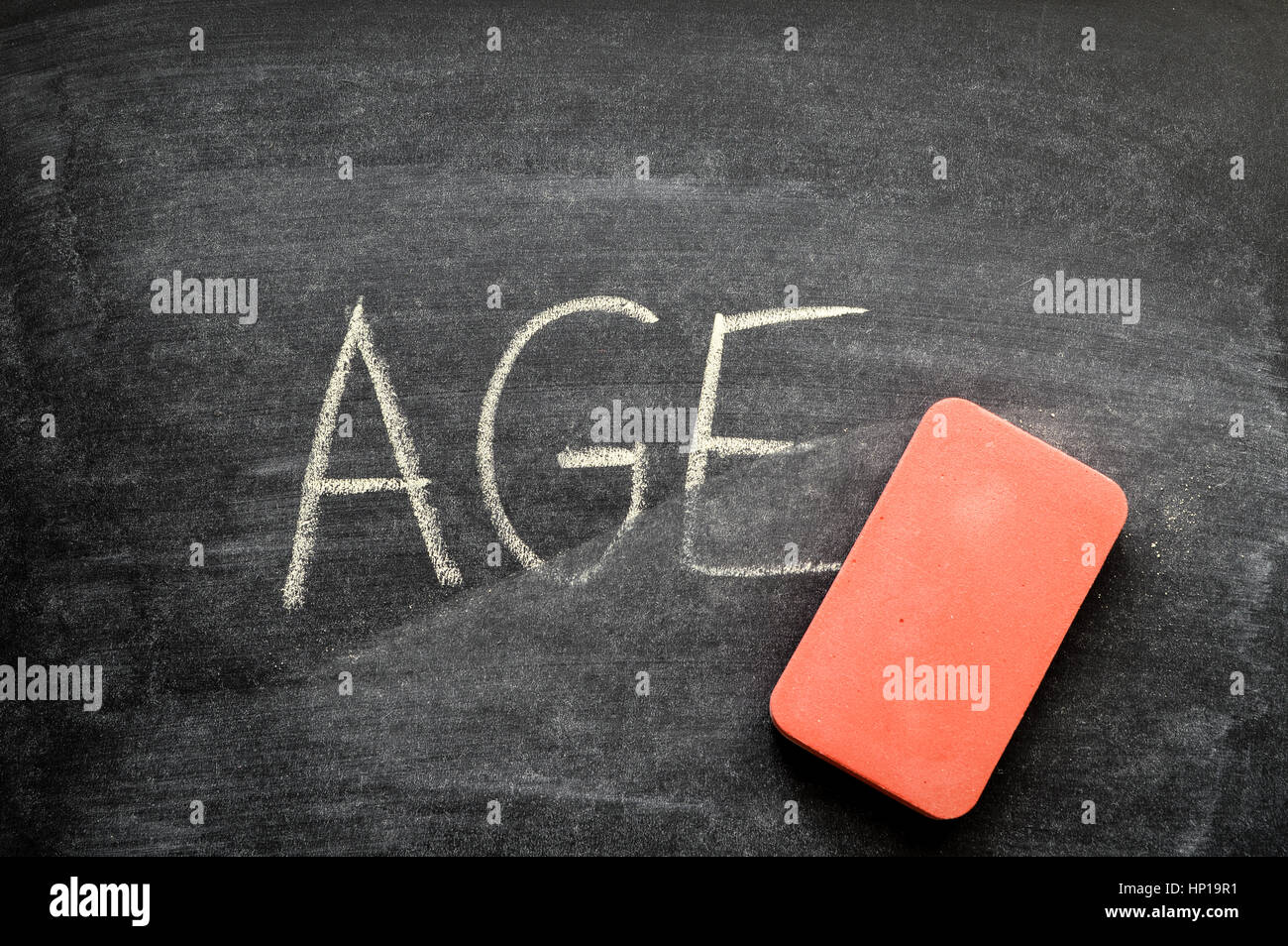 erasing age, hand written word on blackboard being erased concept Stock ...