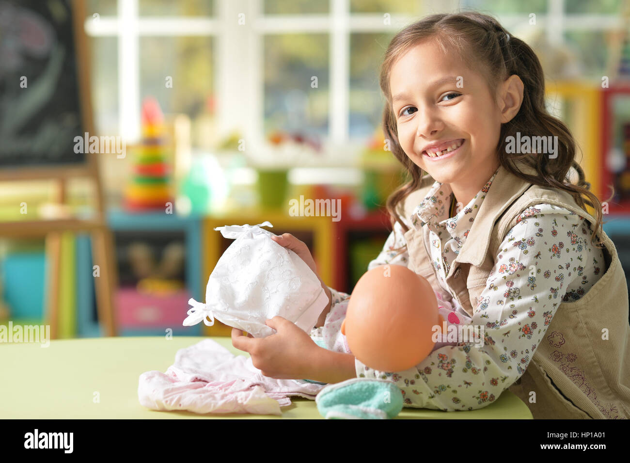 girl playing with doll Stock Photo - Alamy