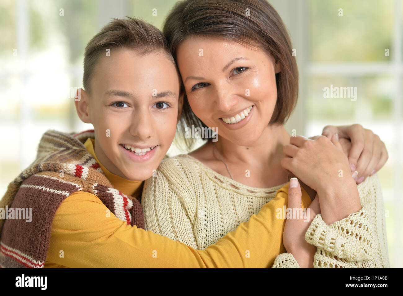 young mother and son smiling Stock Photo - Alamy