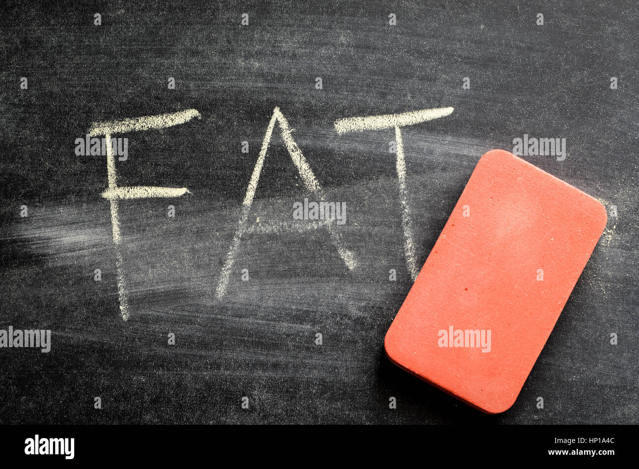 erasing fat, hand written word on blackboard being erased concept Stock ...