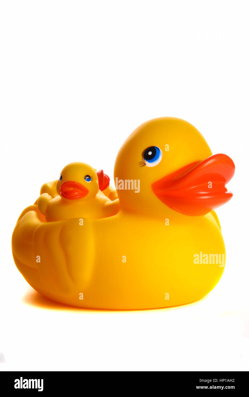 yellow rubber toys ducks isolated Stock Photo - Alamy