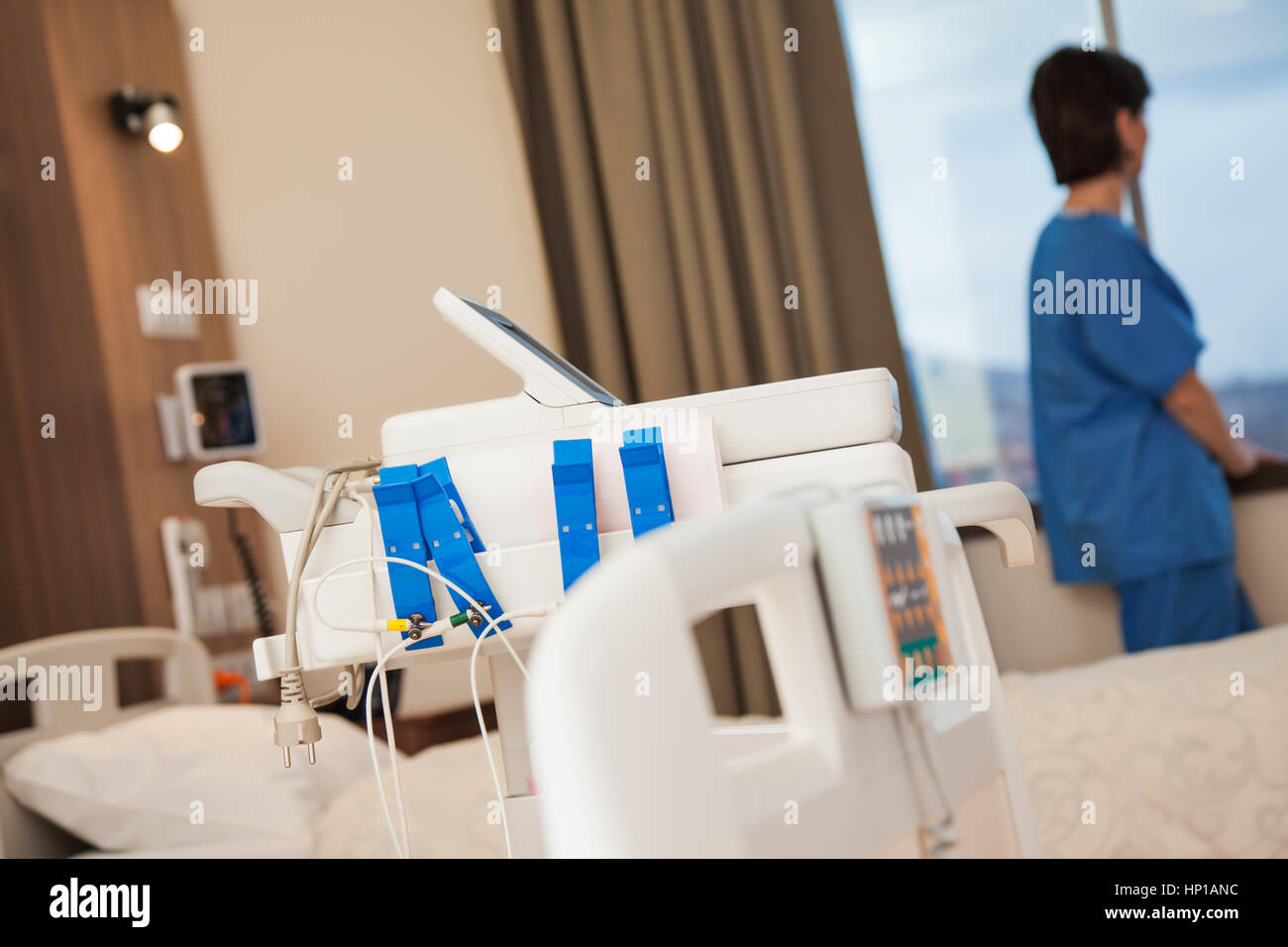 Cardiac stress test equipment in a modern hospital room with a blurred ...