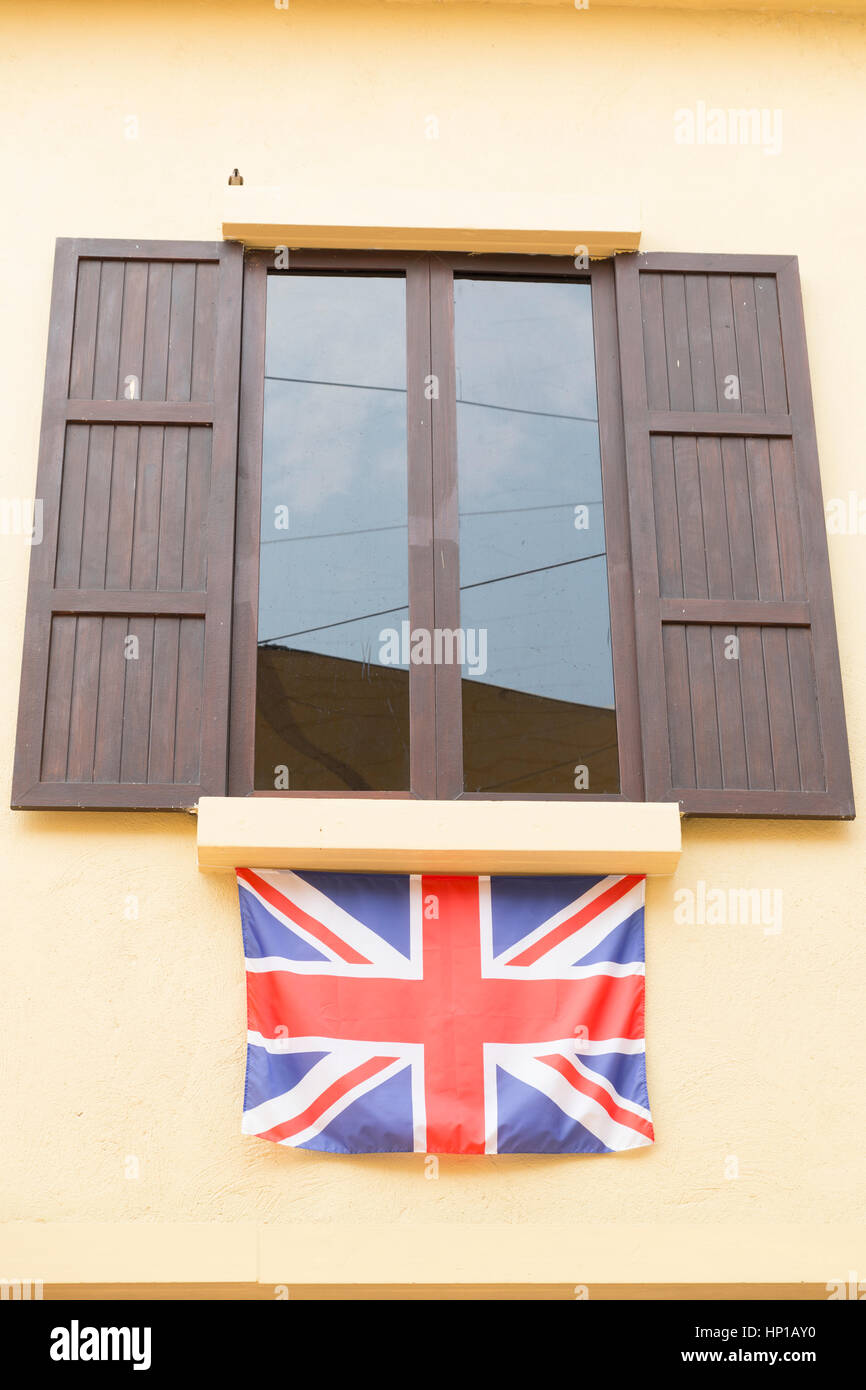 brown wooden window and tinted glass decorating with united kingdom ...