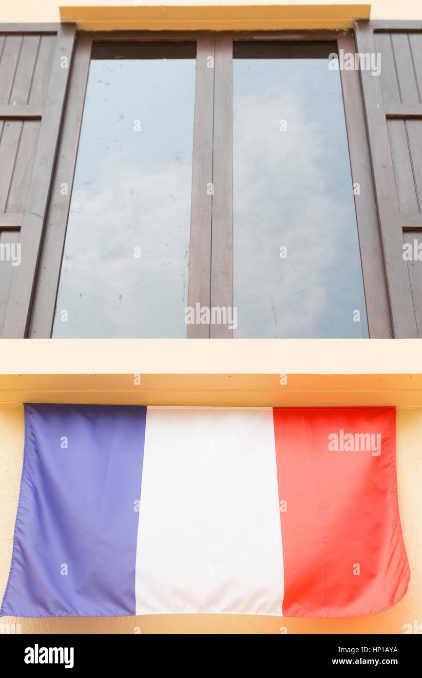 brown wooden window with tinted glass decorating with france national ...