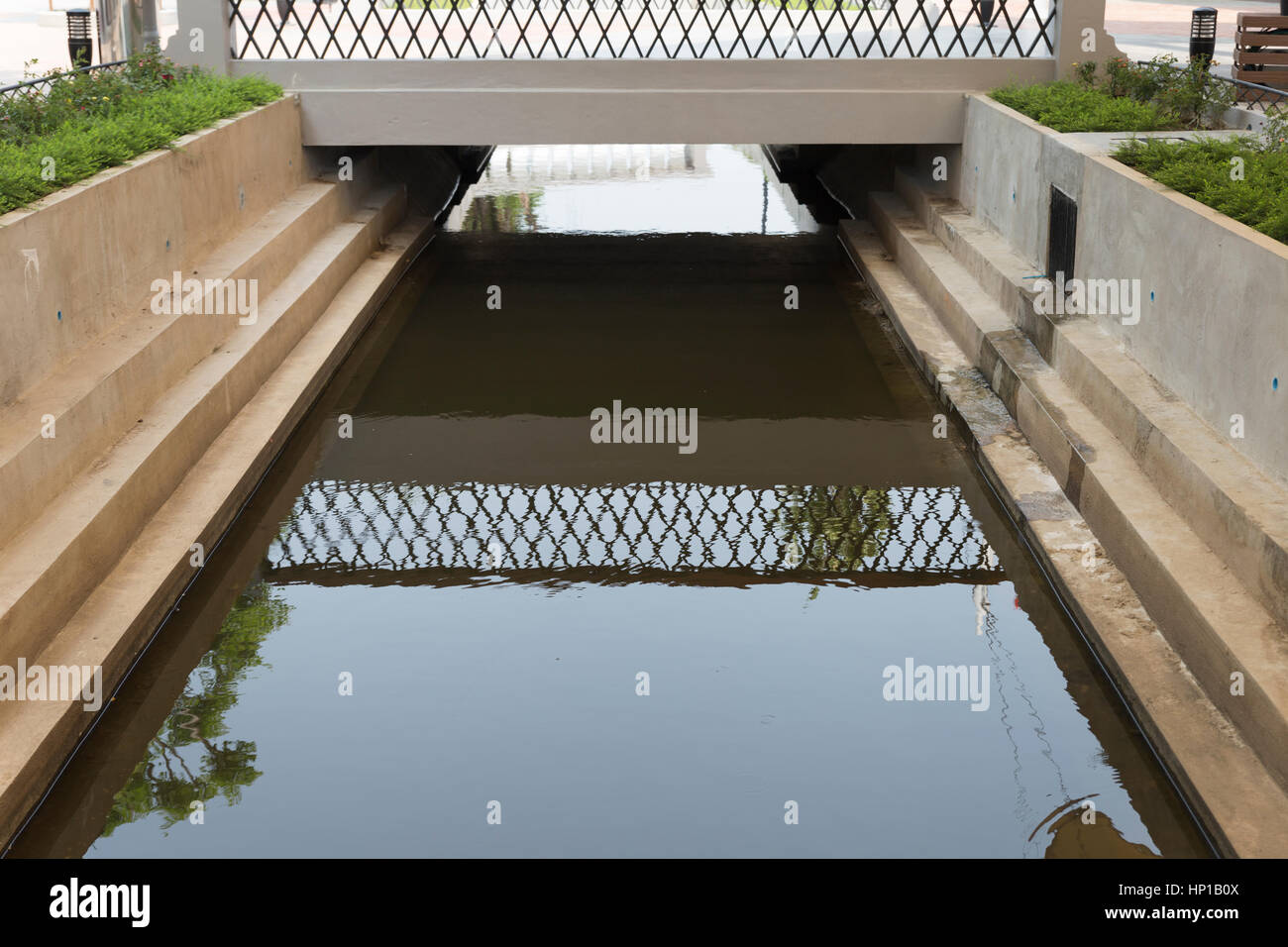 pedestrian footbridge across small canal in park Stock Photo - Alamy