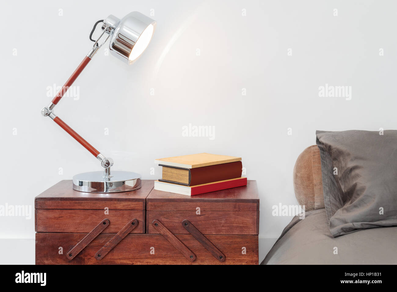 Retro Style Table With Lamp And Books Stock Photo - Alamy