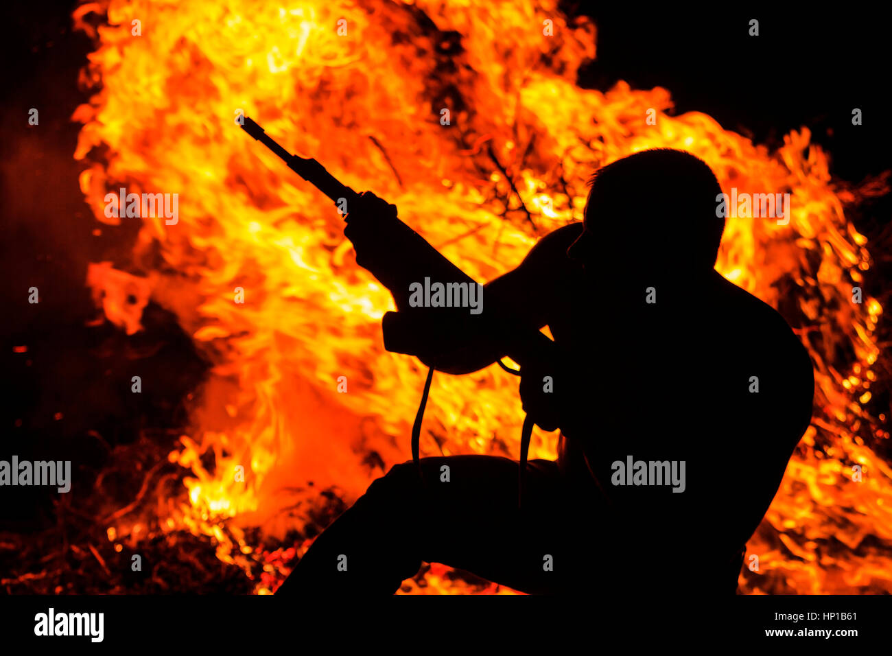 activist with a gun,conflict, war, enmity, strife war for resources ...