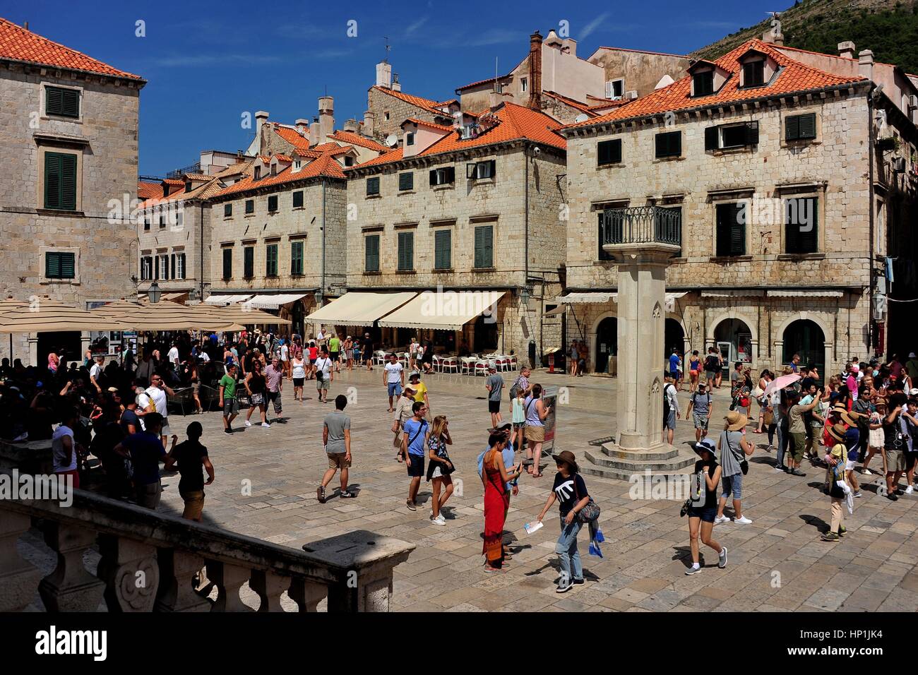 Tourists visit the market square of the historic old town of Dubrovnik ...