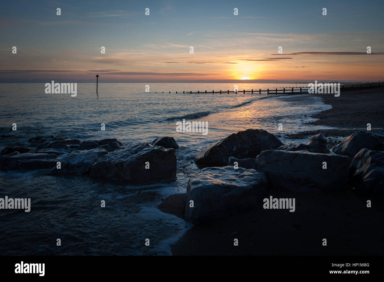 A beautiful sunset over the sea on the beach at Rustington, West Sussex ...