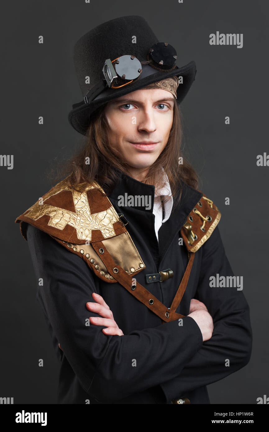 Handsome male Steam punk. Retro man portrait over grunge background ...