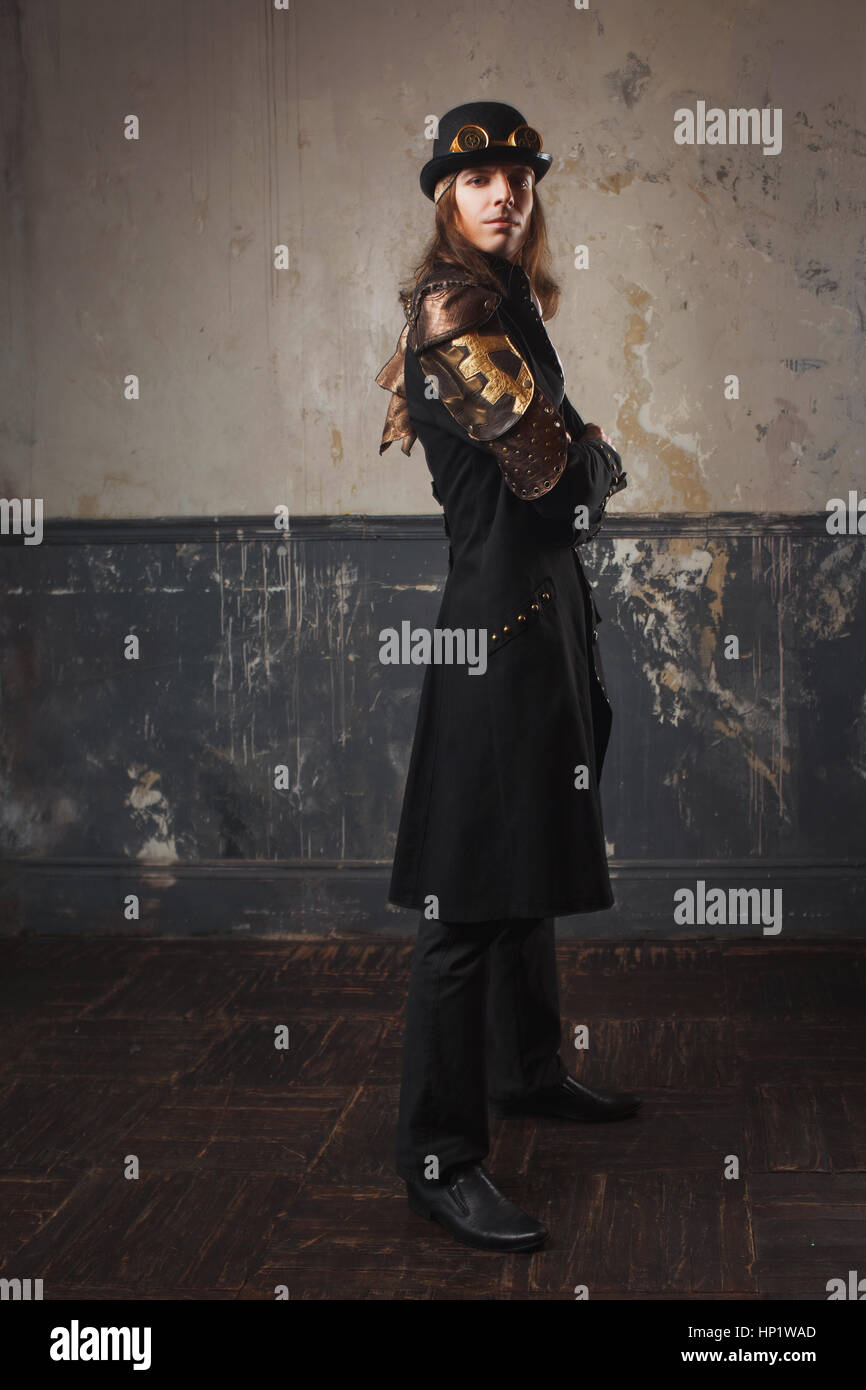 Handsome male Steam punk. Retro man portrait over grunge background ...