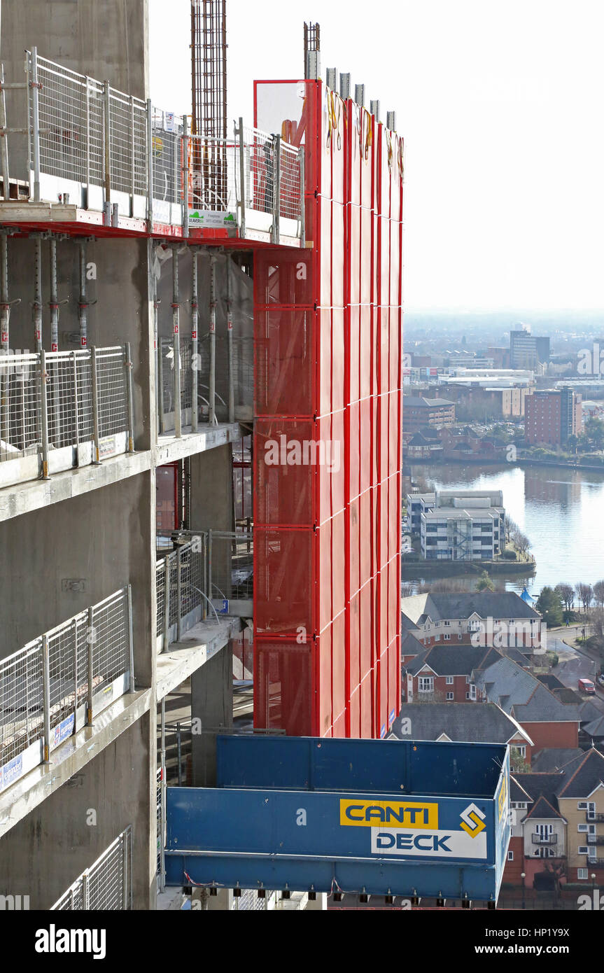 Climbing, protective screens surround the top of a new, concrete framed ...