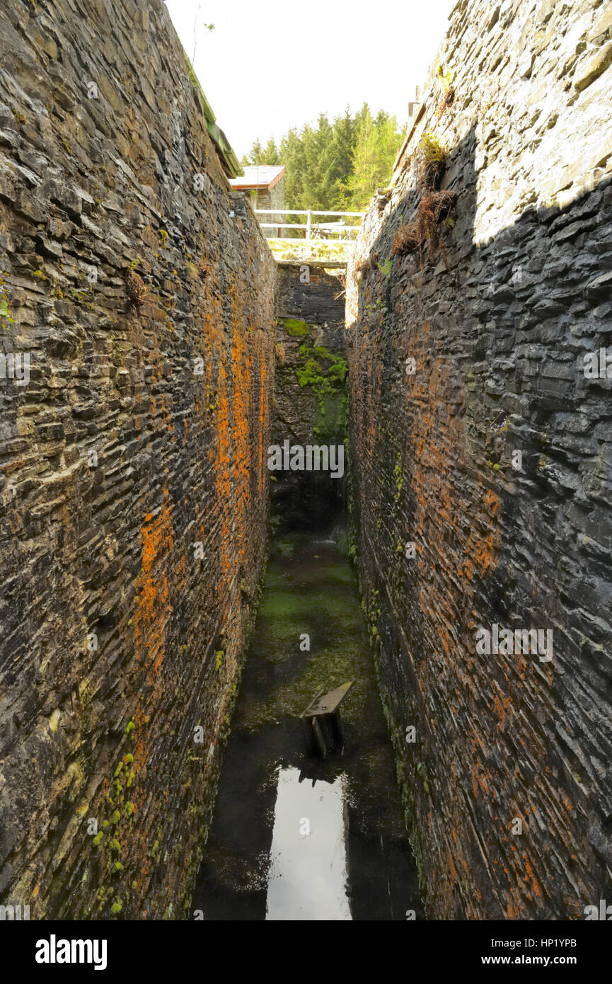 Large water wheel pit at Silver Mountain Mine Stock Photo - Alamy