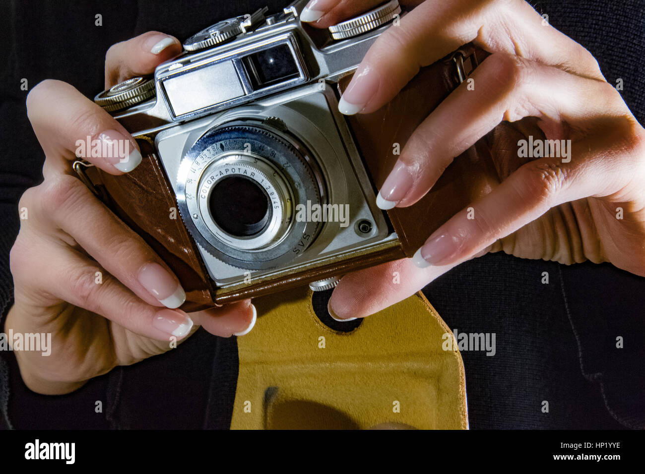 Female hand holding camera hi-res stock photography and images - Alamy
