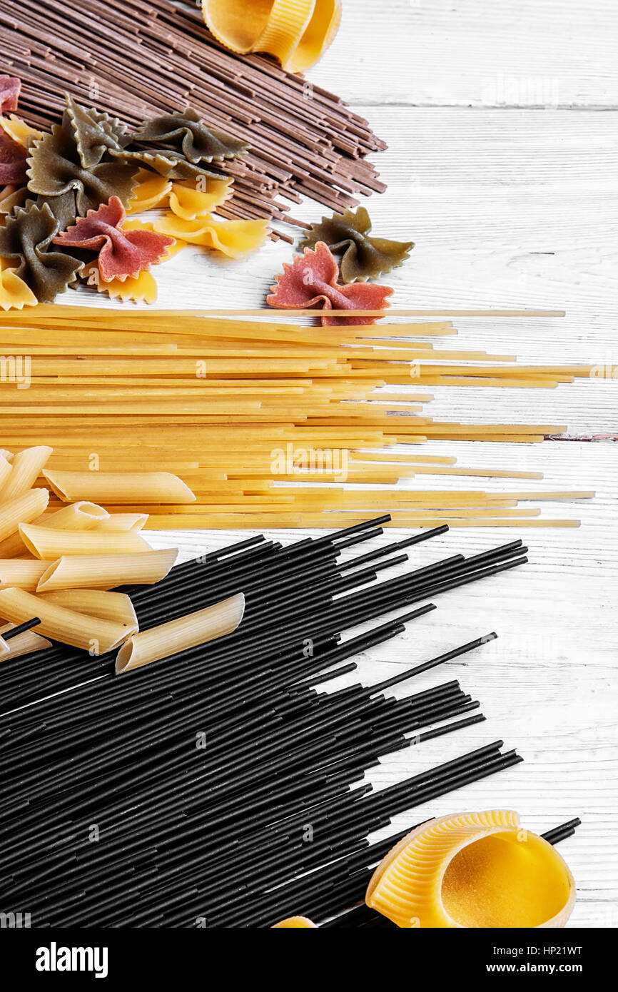 Set raw spaghetti and macaroni on the kitchen table Stock Photo - Alamy