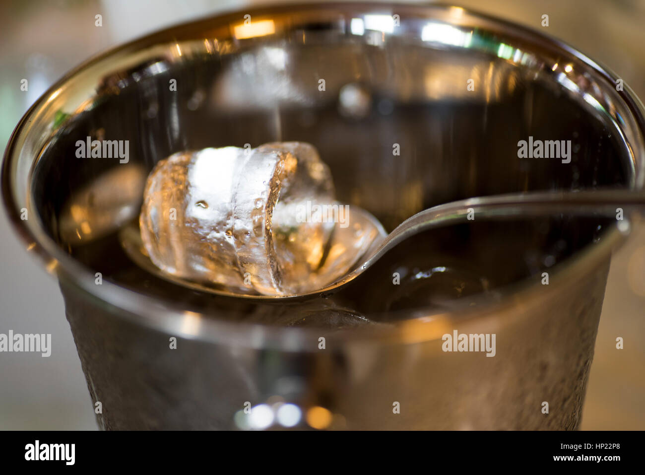 Ice in spoon Stock Photo - Alamy