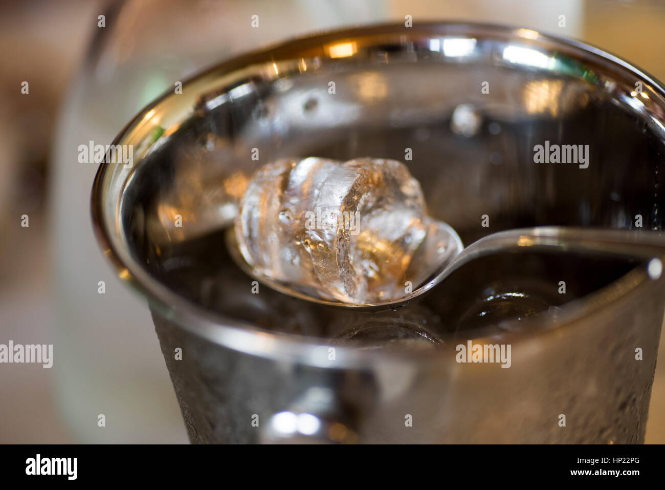 Ice in spoon Stock Photo - Alamy