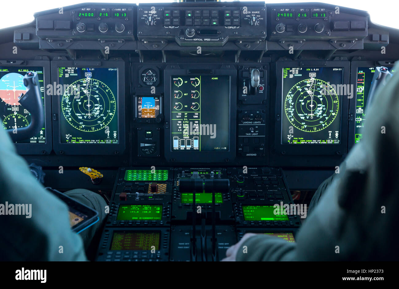 A cockpit of a military carrier airplane during flight. Pilots flying ...