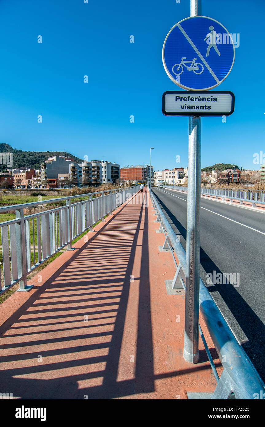 Pedestrian preference sign, wew bridge over the river Besós with metal ...
