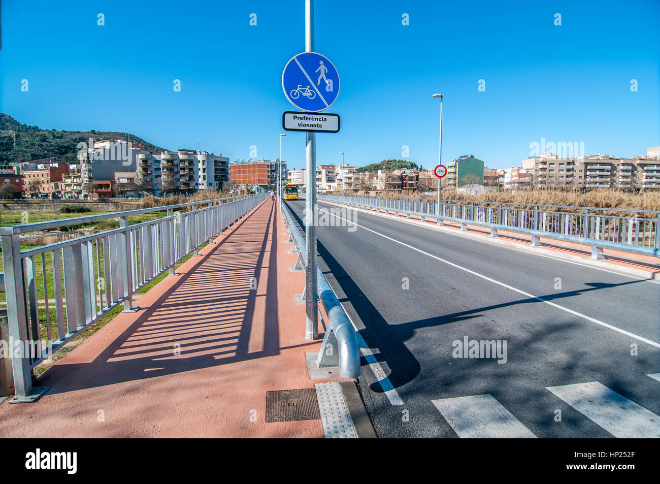 Pedestrian preference sign, wew bridge over the river Besós with metal ...