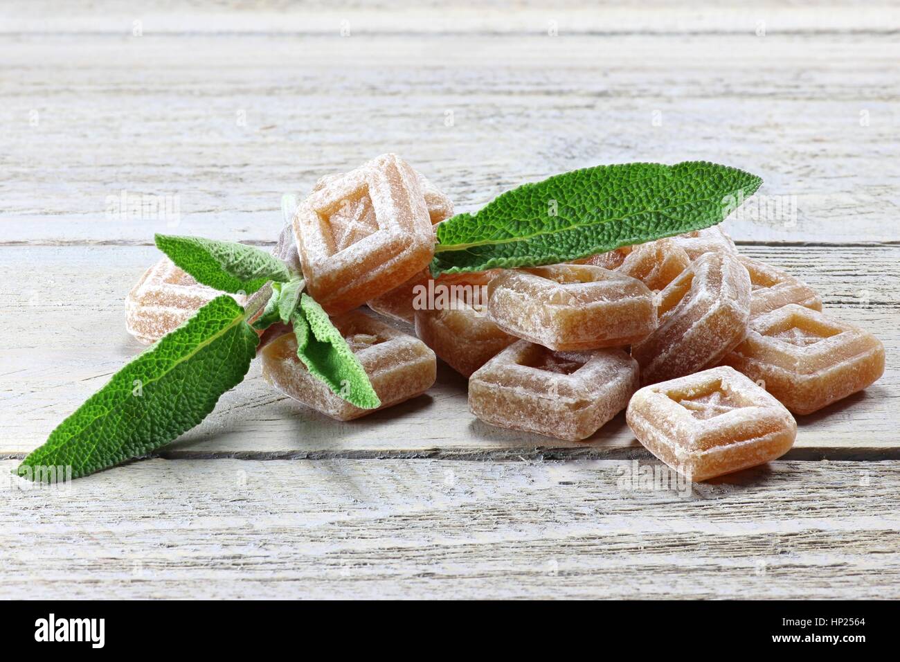 sage candies on wooden background Stock Photo - Alamy