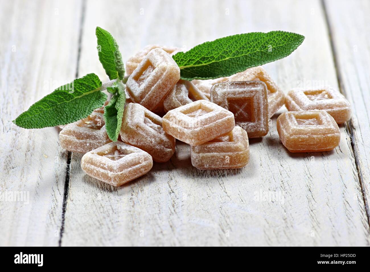 sage candies on wooden background Stock Photo - Alamy