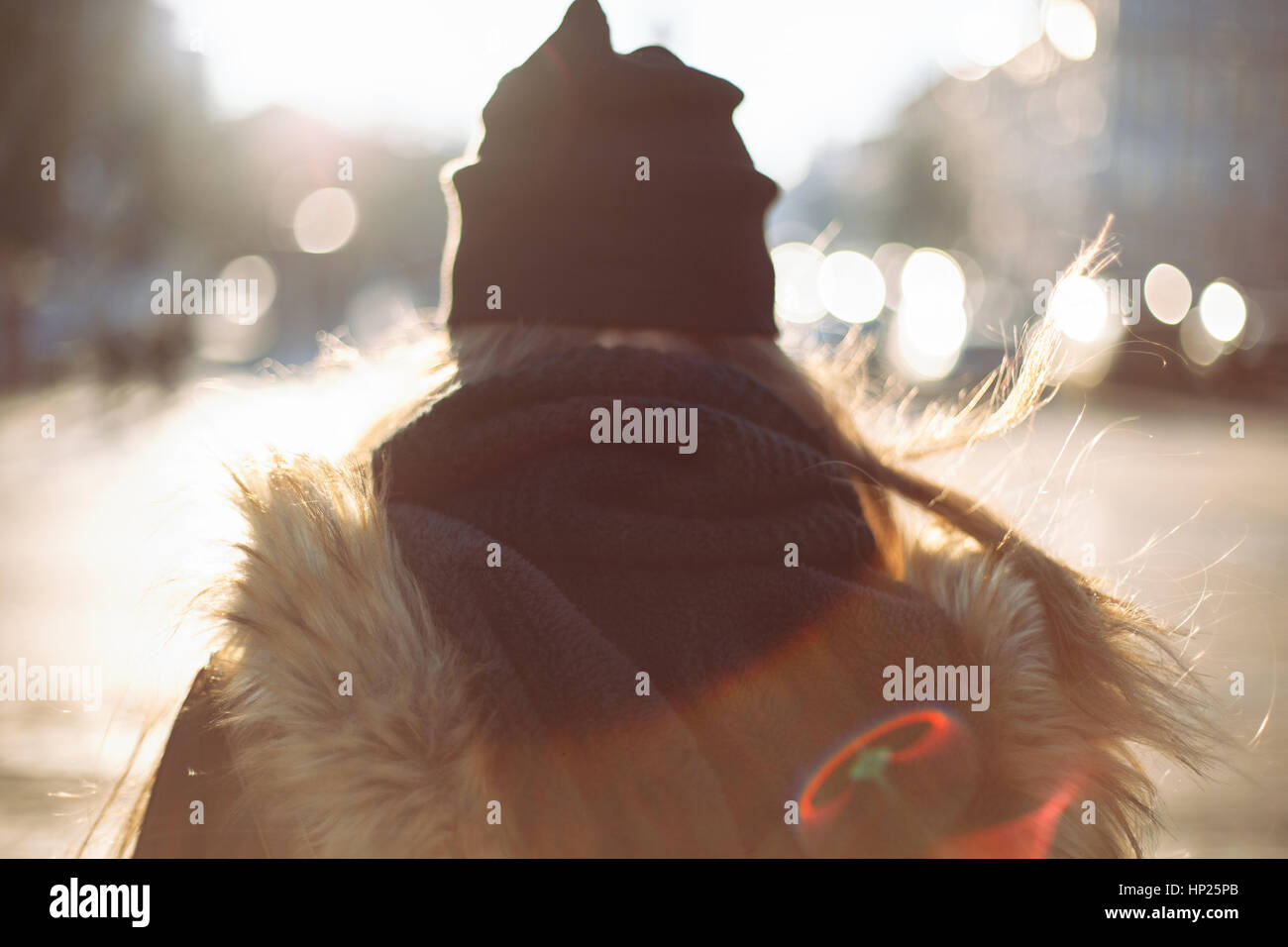 Back view of a hipster girl walking on city street Stock Photo - Alamy
