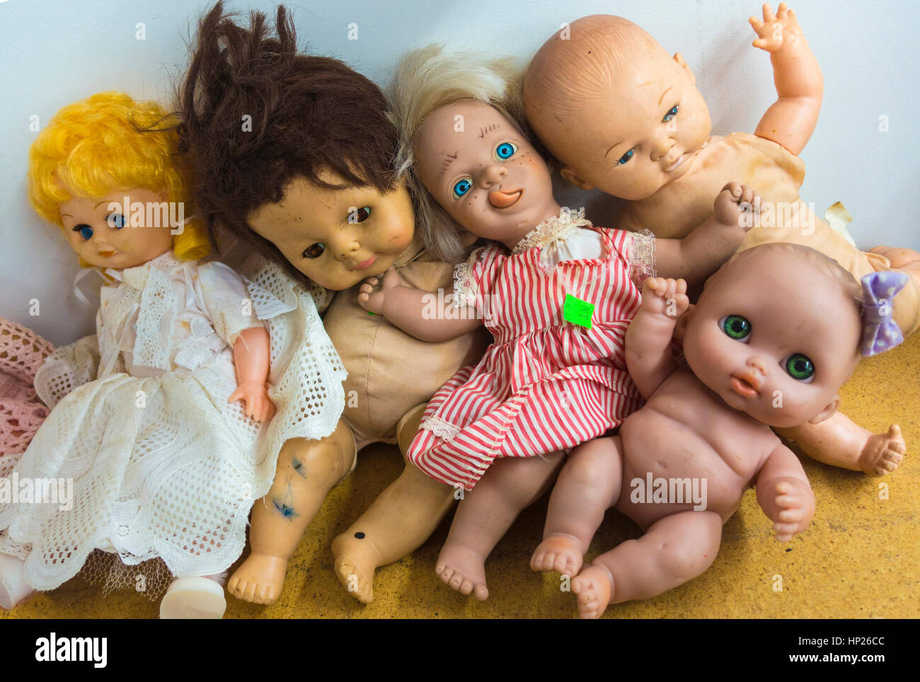group of discarded toy dolls Stock Photo - Alamy