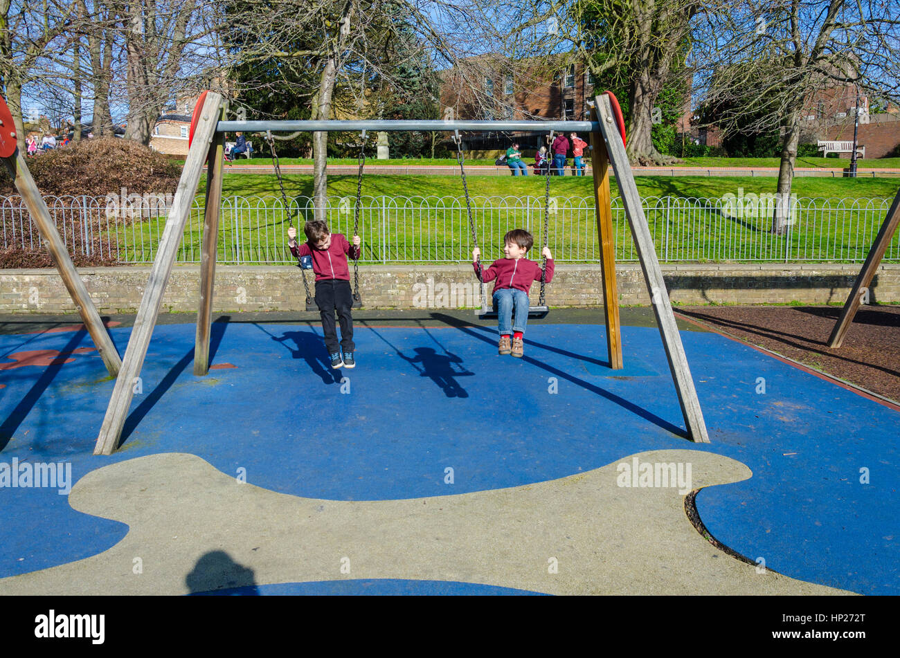 Children playing on swings in hi-res stock photography and images - Alamy