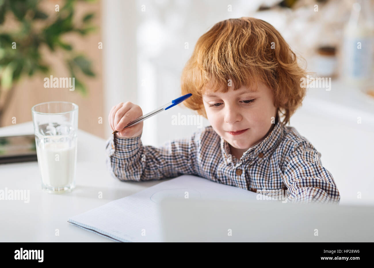 Thoughtful little student studying in the morning Stock Photo - Alamy