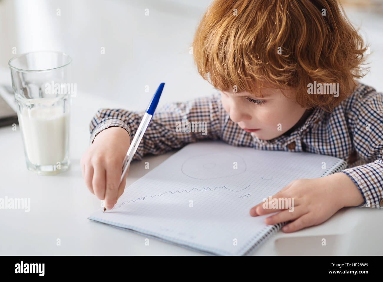 Creative clever boy making a drawing Stock Photo - Alamy