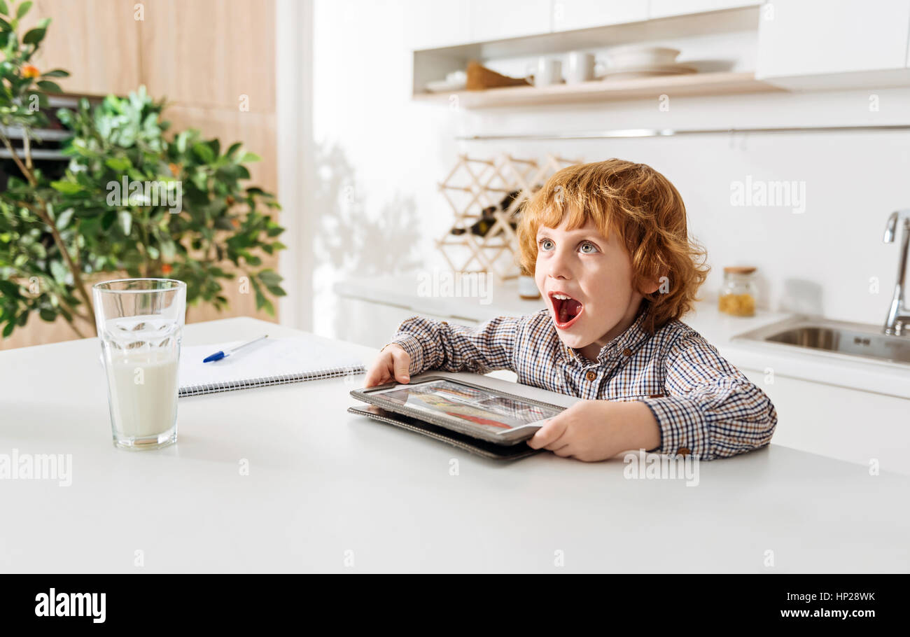 Goofy adorable kid looking surprised Stock Photo - Alamy