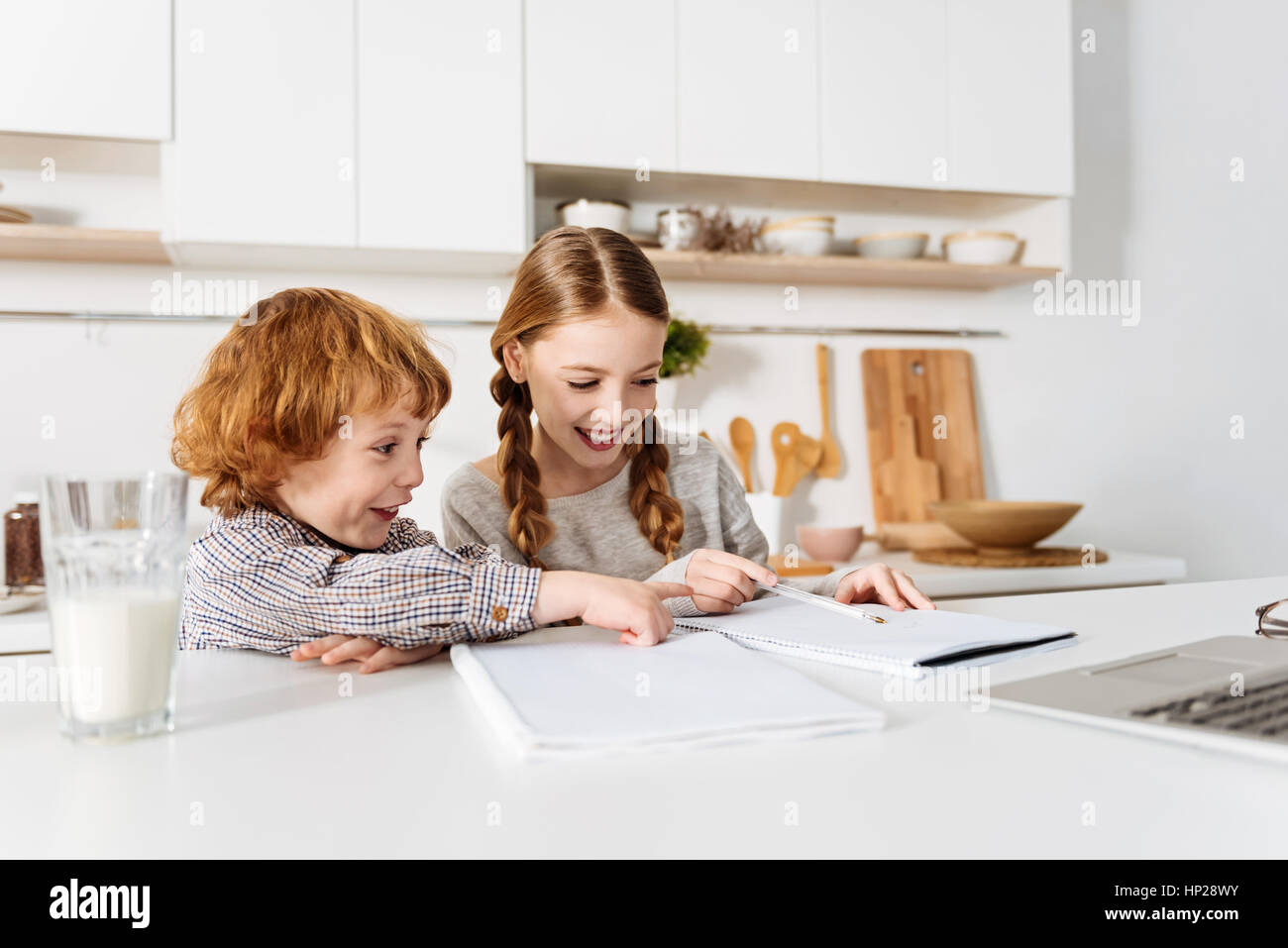 Enthusiastic girl explaining something to her brother Stock Photo - Alamy