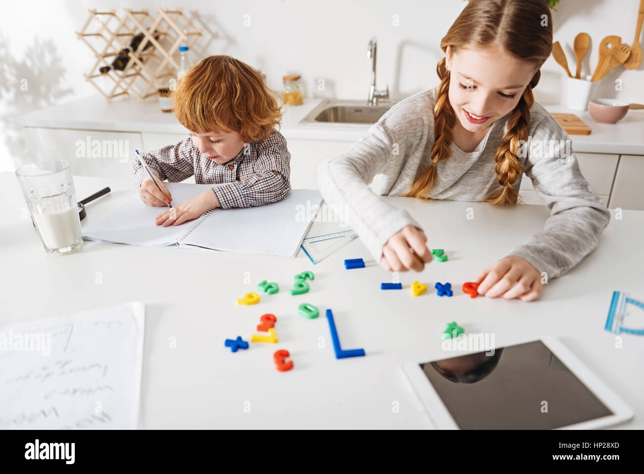 Admirable girl explaining math to her brother Stock Photo - Alamy
