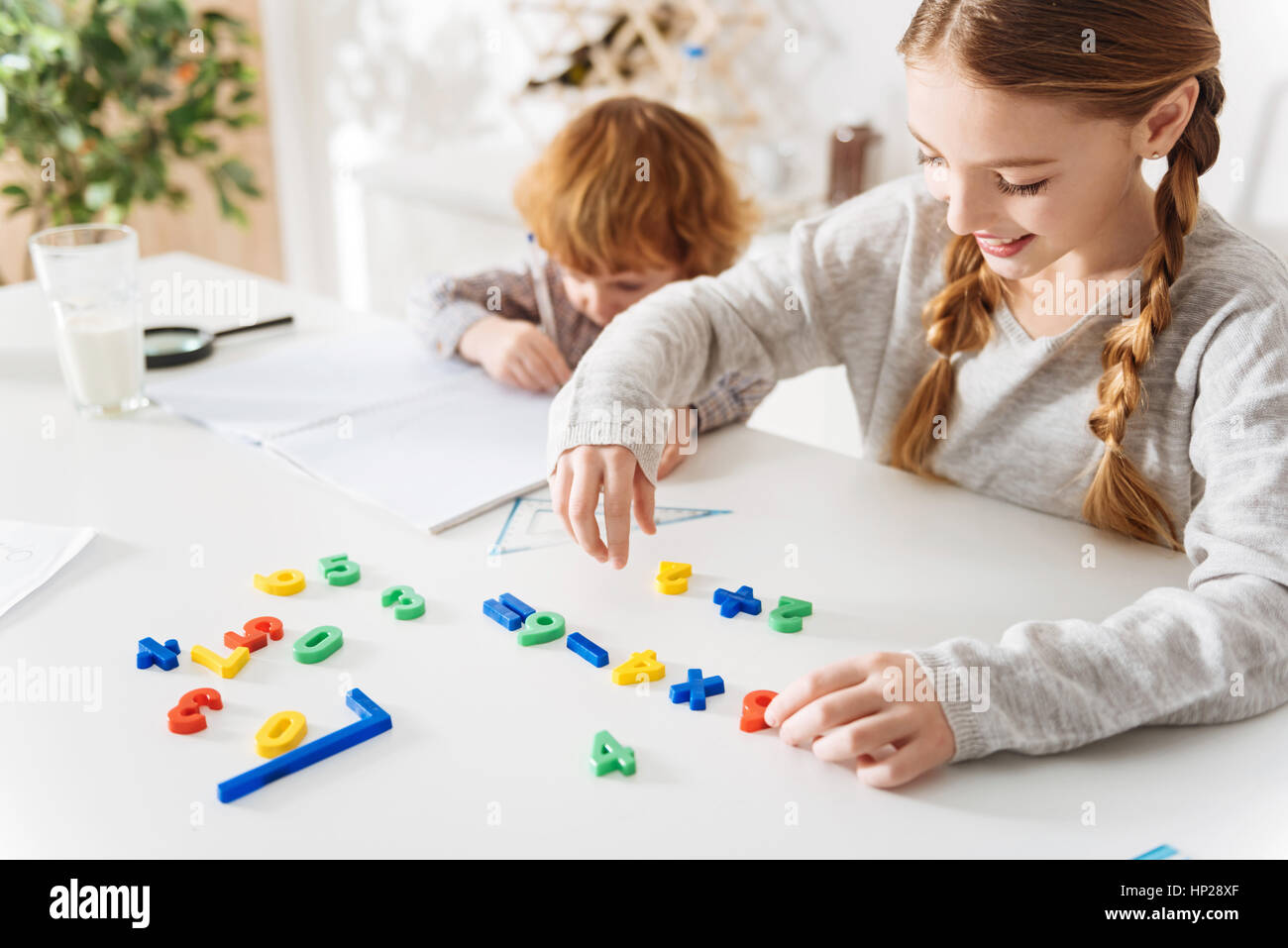 Boy helping girl math hi-res stock photography and images - Alamy