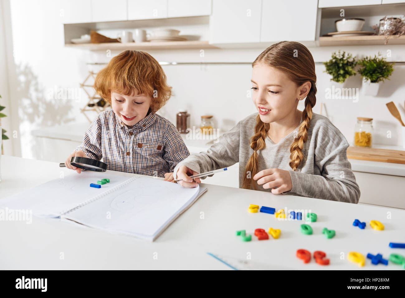 Boy helping girl math hi-res stock photography and images - Alamy