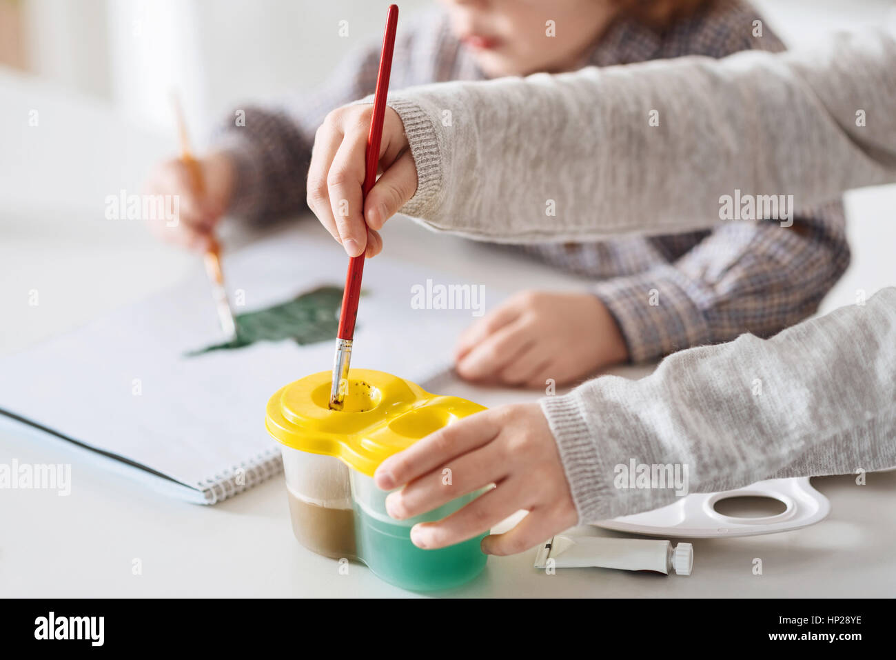 Talented creative children doing art together Stock Photo - Alamy