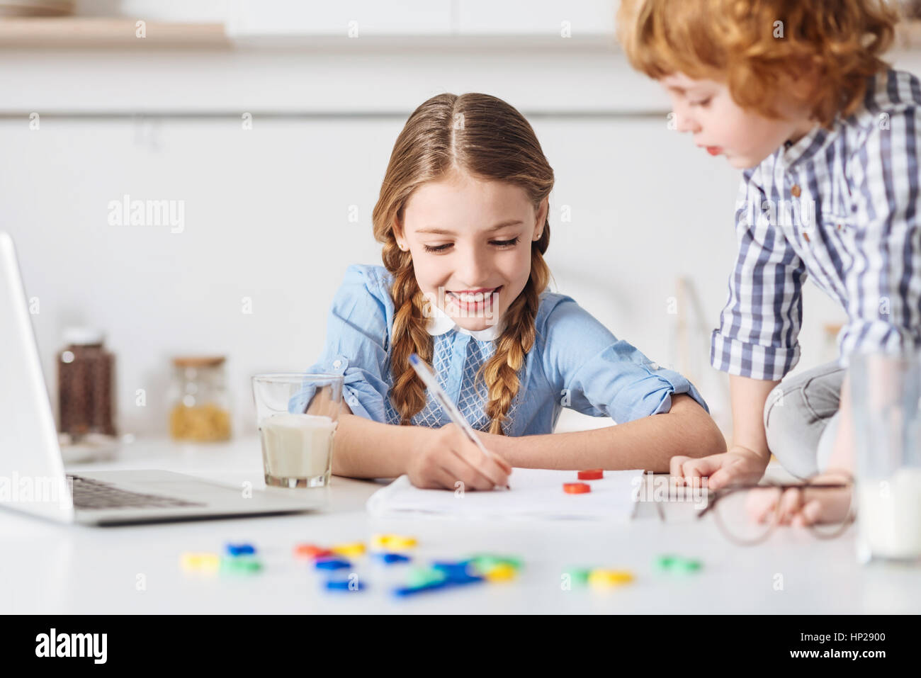 Creative dedicated girl working on her math project Stock Photo - Alamy