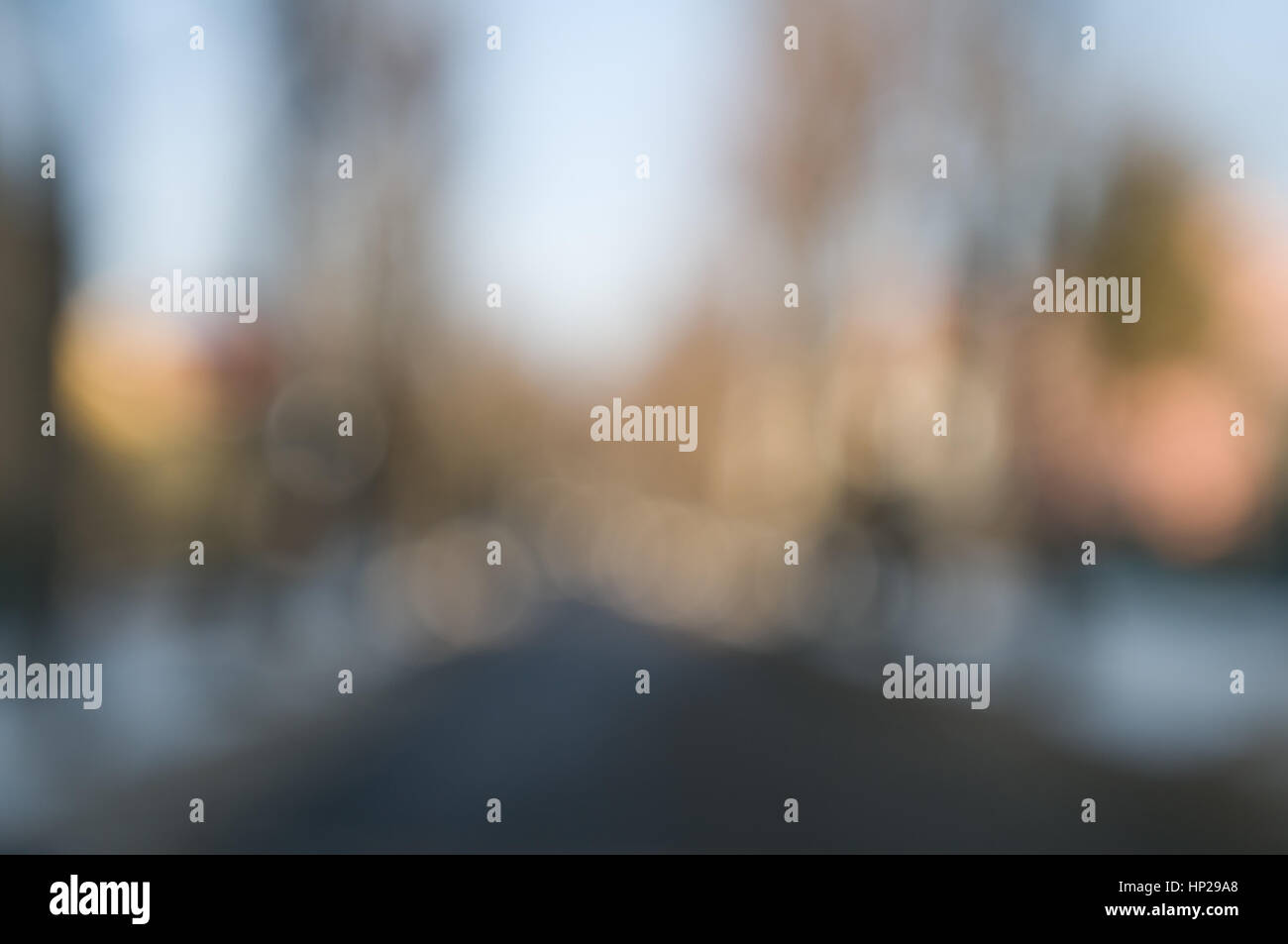 Traffic abstract background with blurry buildings, street signs and ...