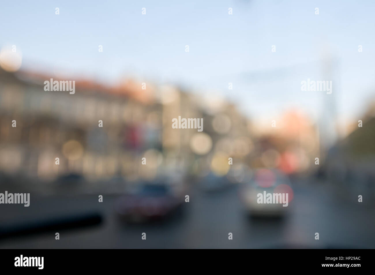 Traffic abstract background with blurry buildings, street signs and ...