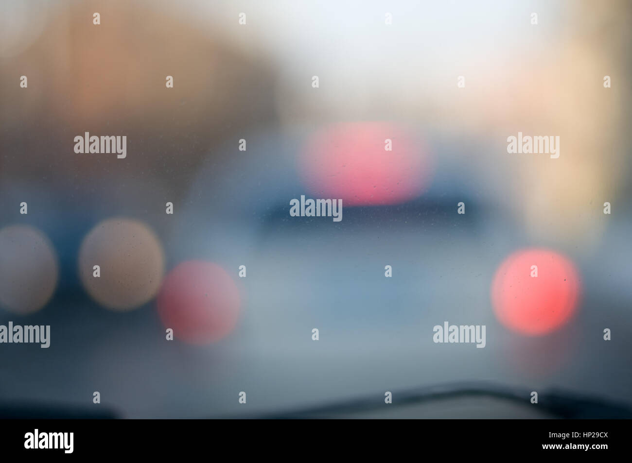 Traffic abstract background with blurry buildings, street signs and ...