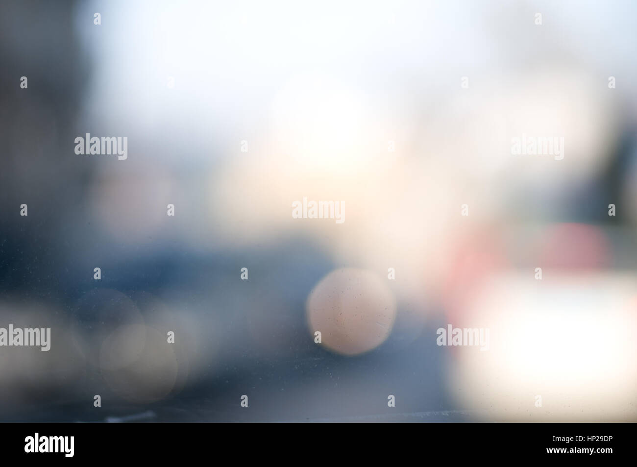 Traffic abstract background with blurry buildings, street signs and ...