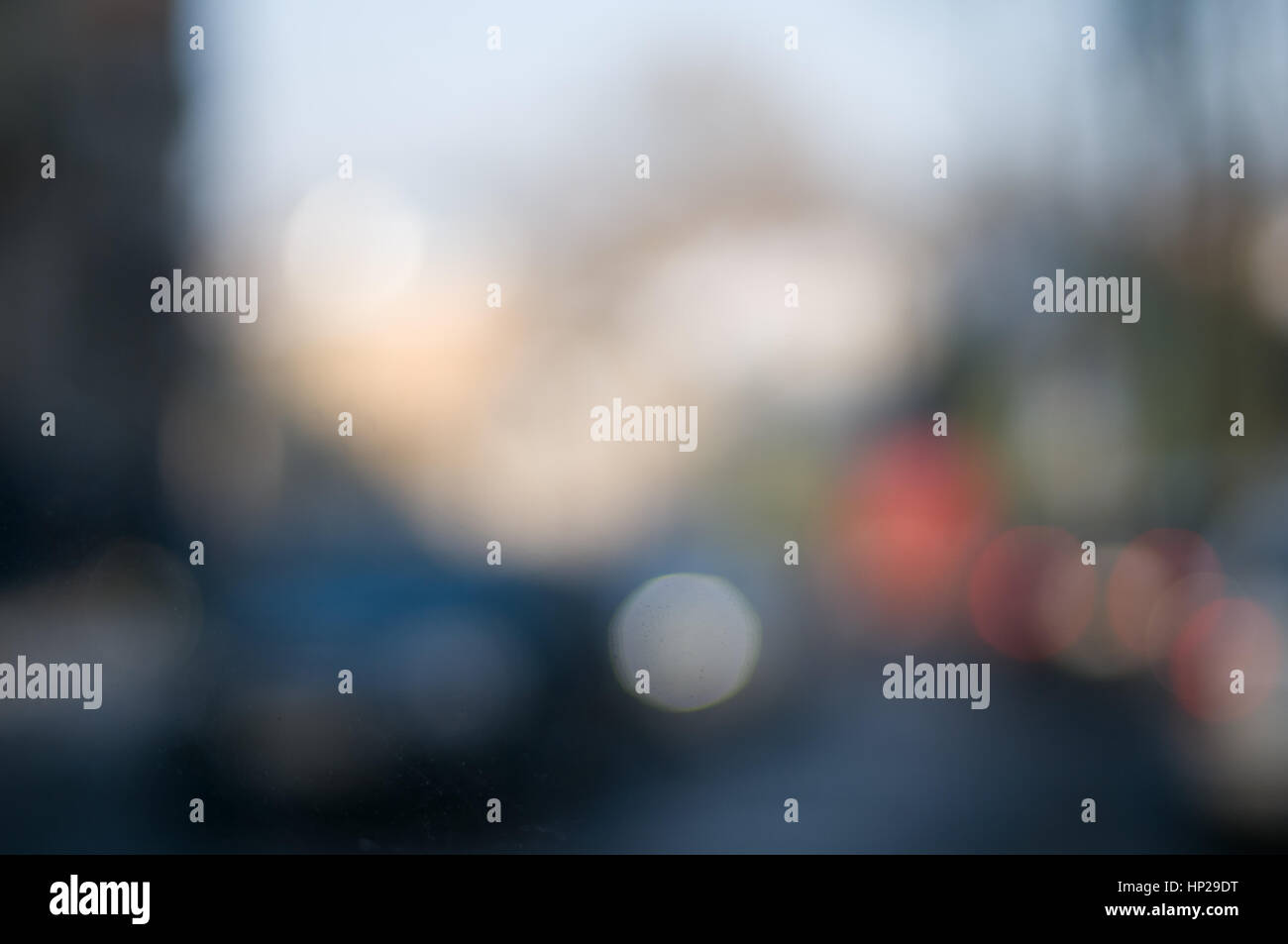 Traffic abstract background with blurry buildings, street signs and ...