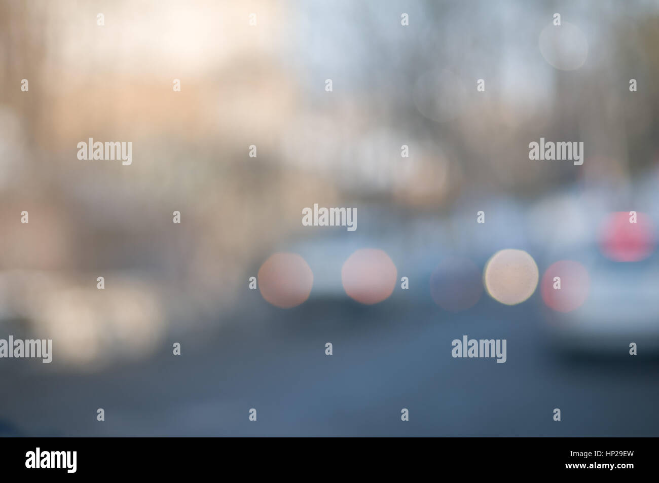 Traffic abstract background with blurry buildings, street signs and ...