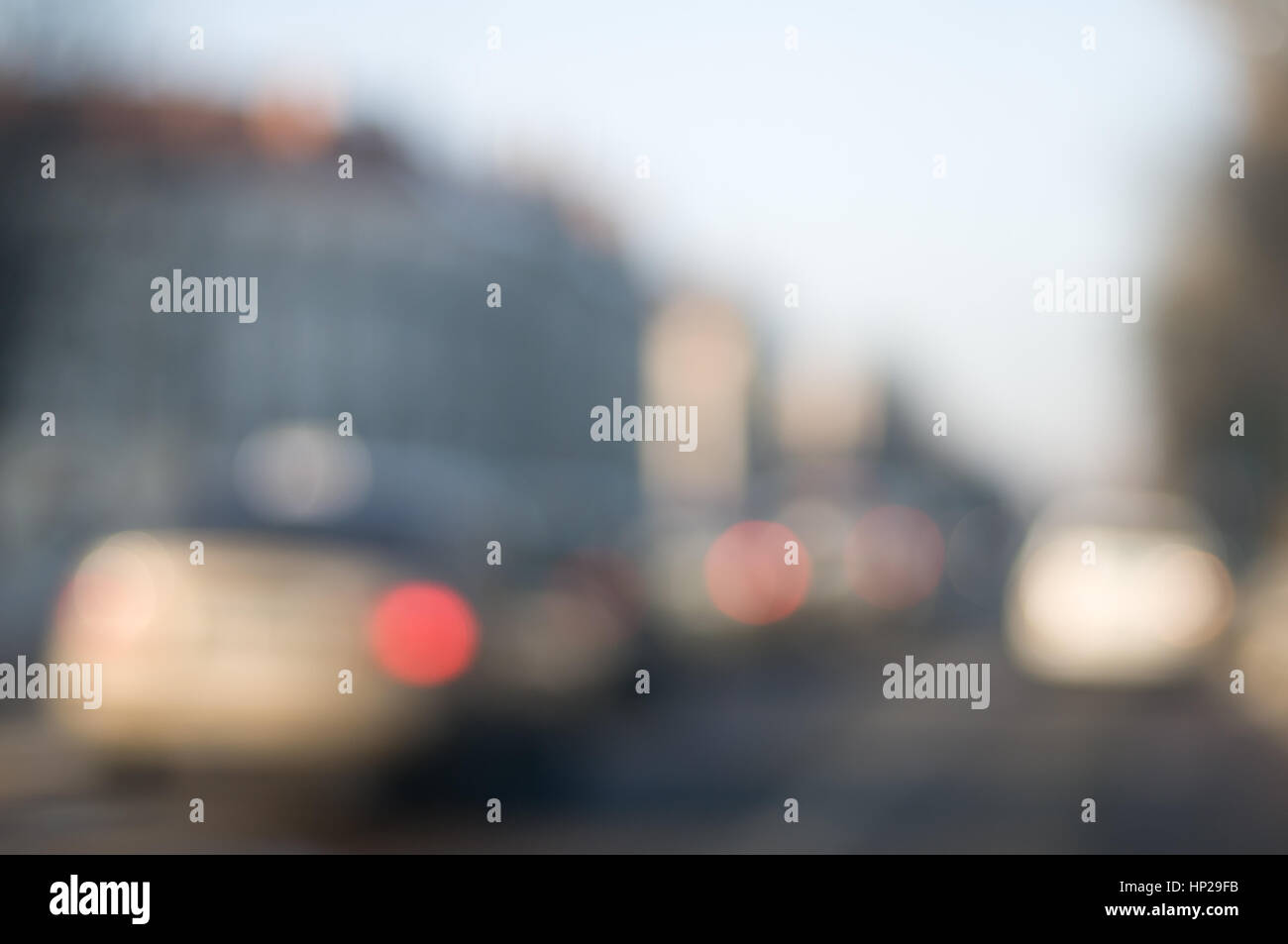 Traffic abstract background with blurry buildings, street signs and ...