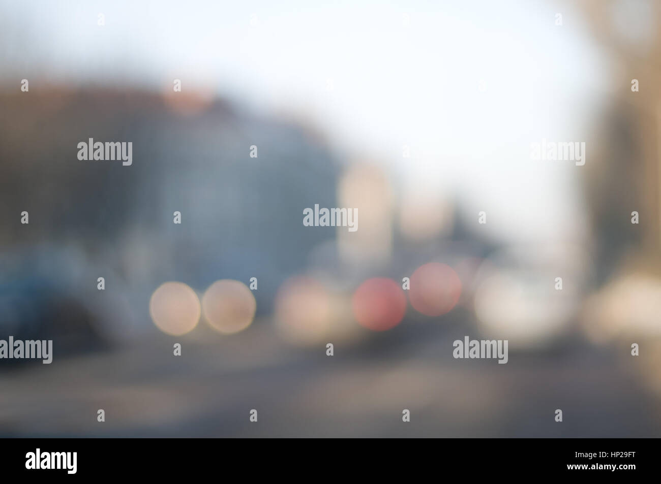 Traffic abstract background with blurry buildings, street signs and ...