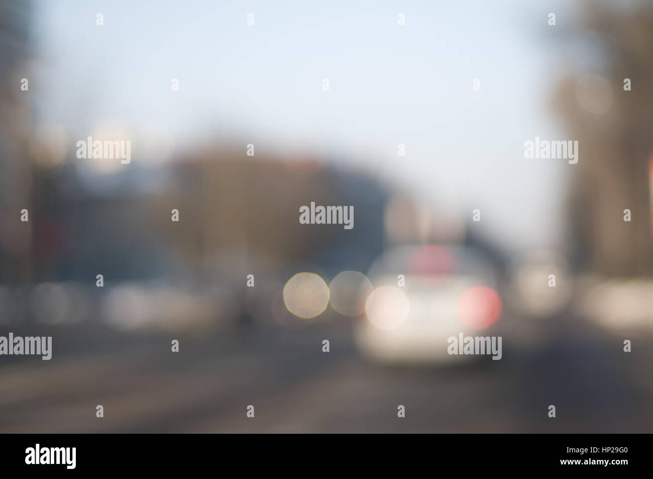 Traffic abstract background with blurry buildings, street signs and ...