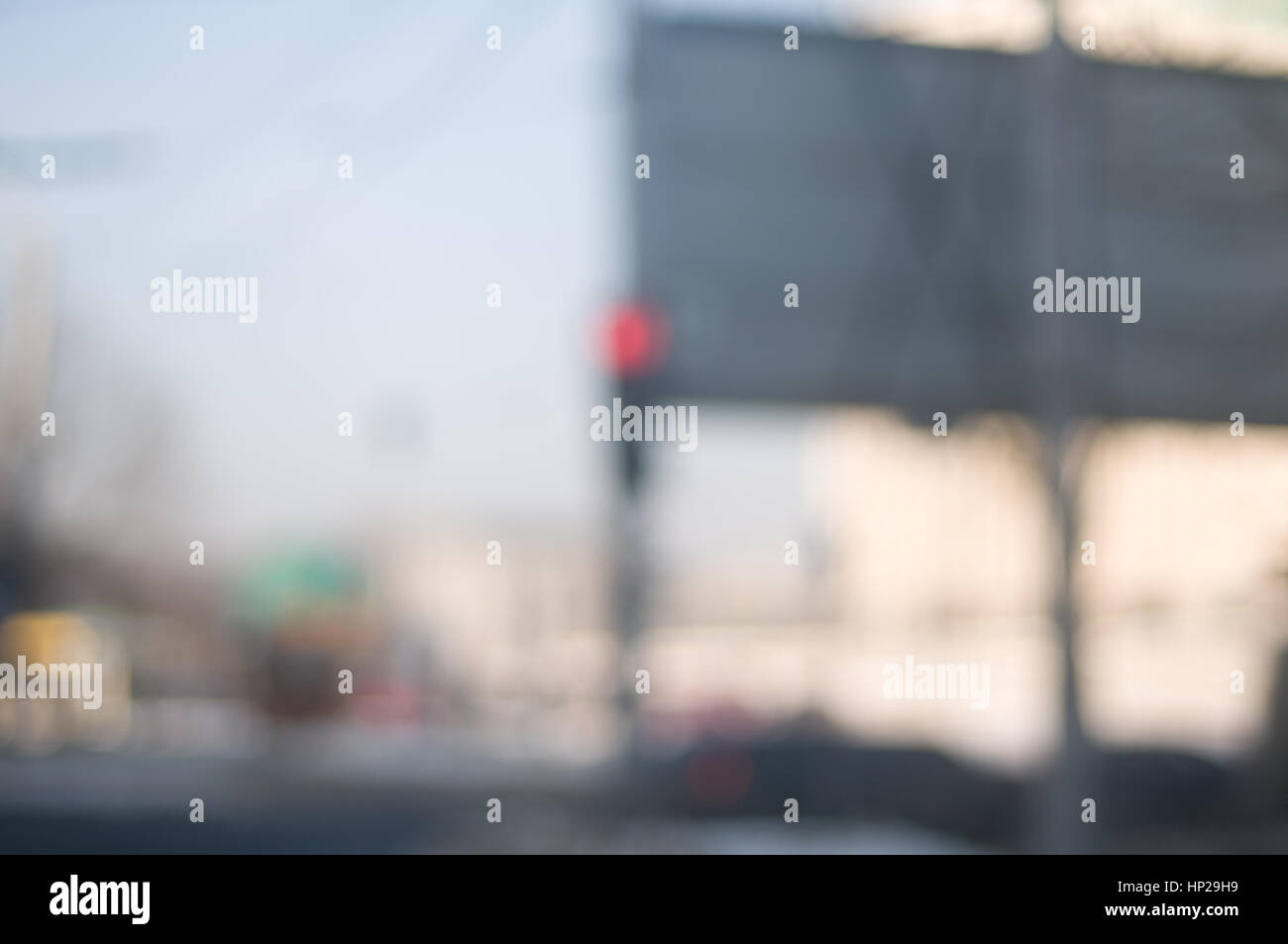 Traffic abstract background with blurry buildings, street signs and ...